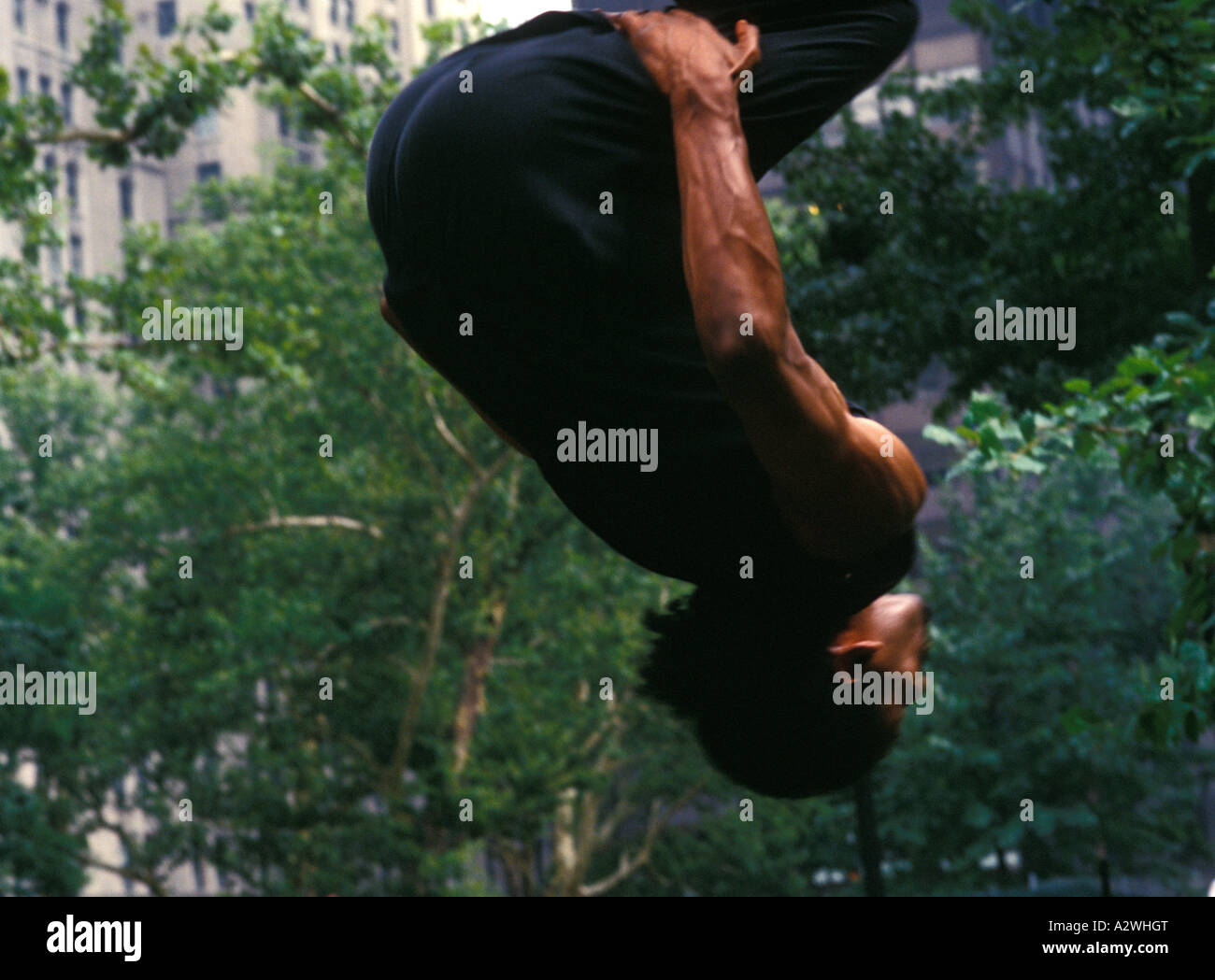 Young man performing somersault Stock Photo - Alamy