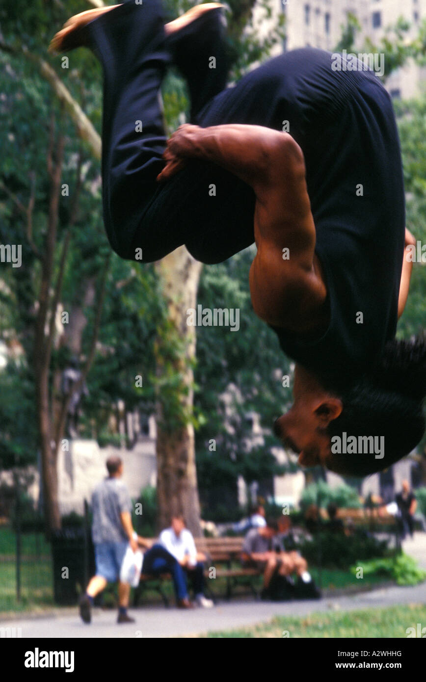 Young man performing somersault hi-res stock photography and images - Alamy