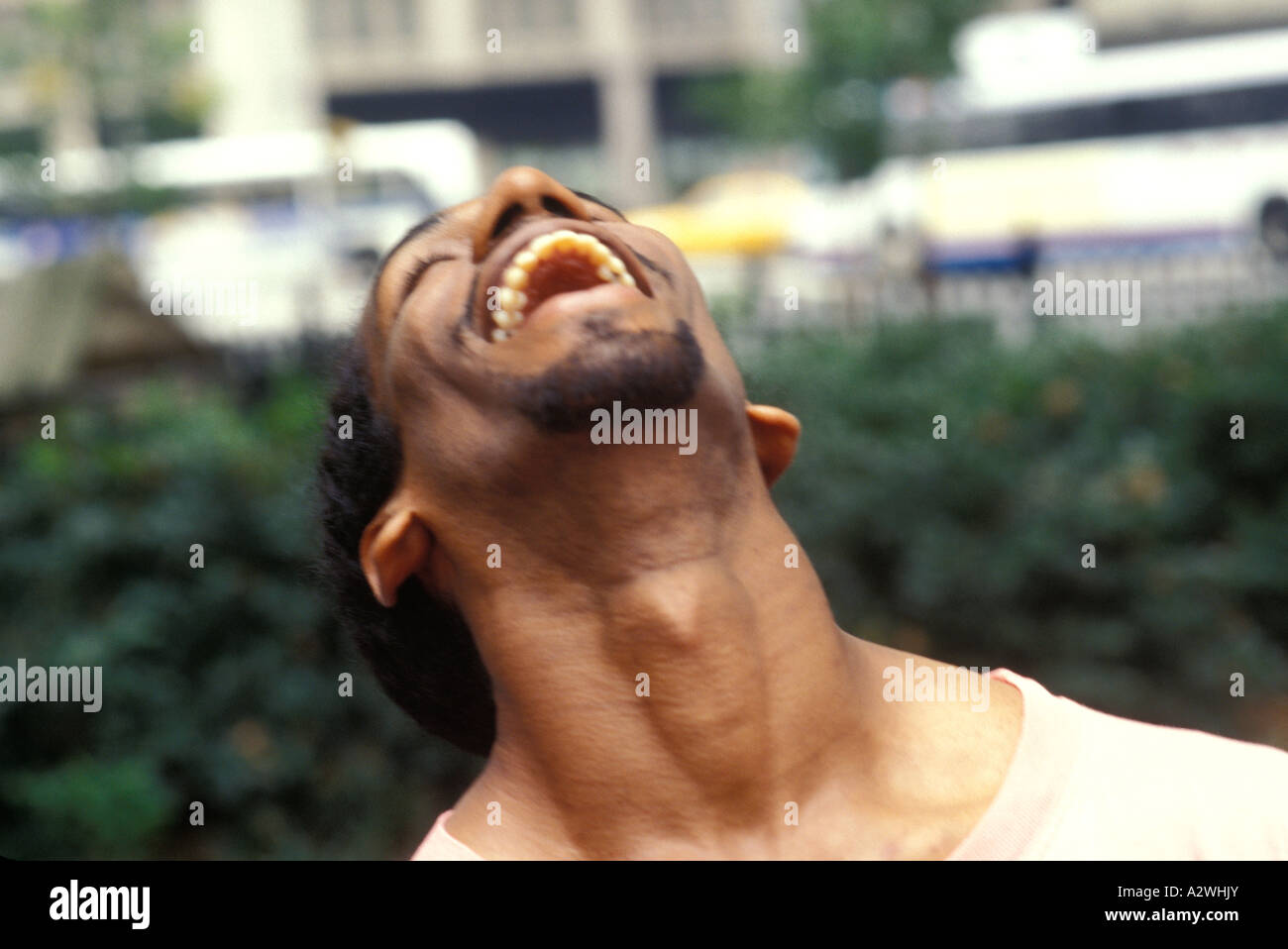 Young man laughing Stock Photo - Alamy