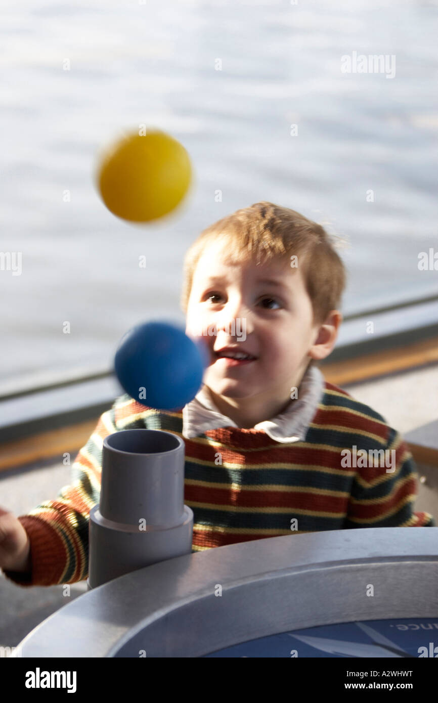Young boy child playing with air suspended ball in Odyssey W5 ...