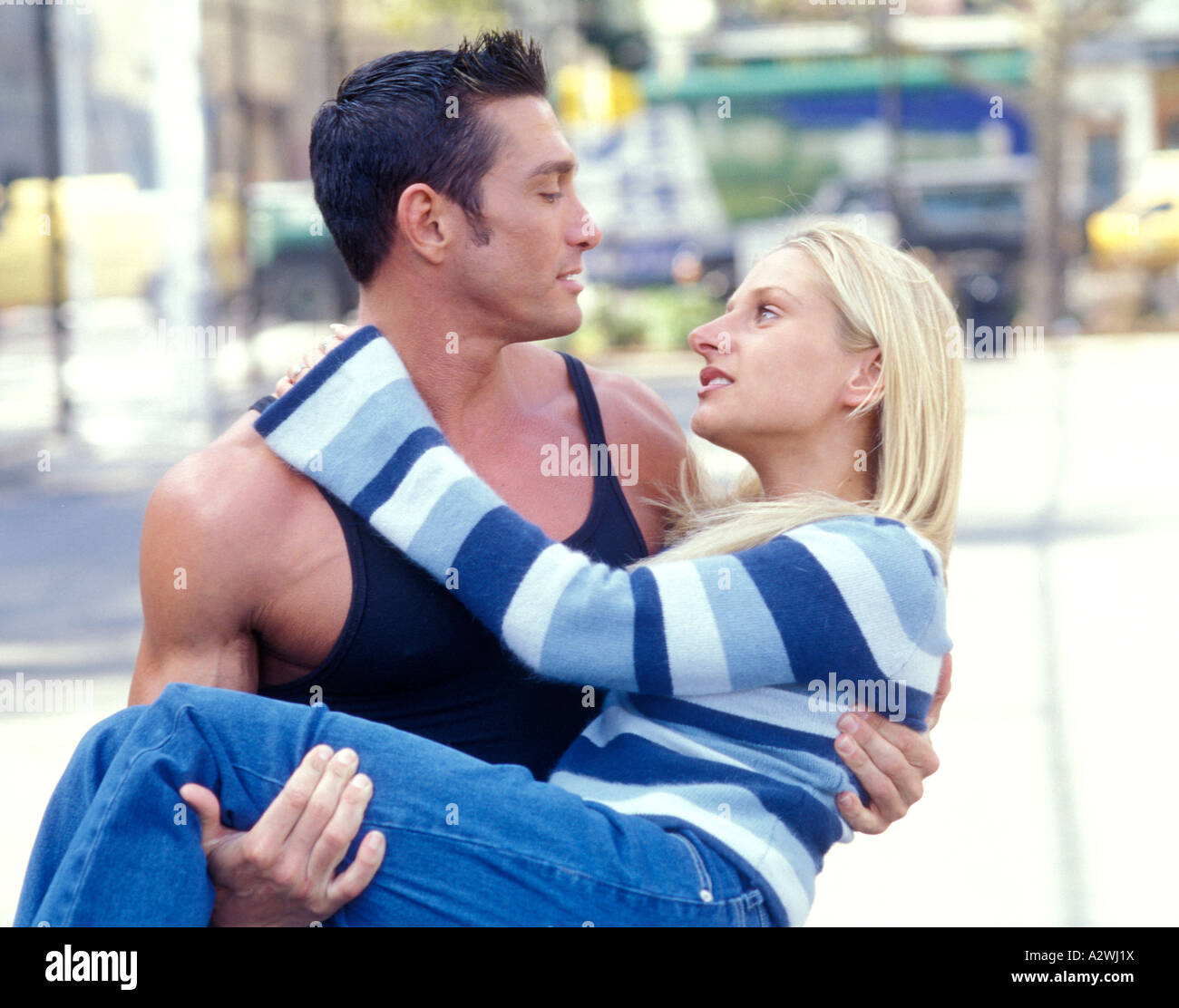 Man carrying woman Stock Photo - Alamy