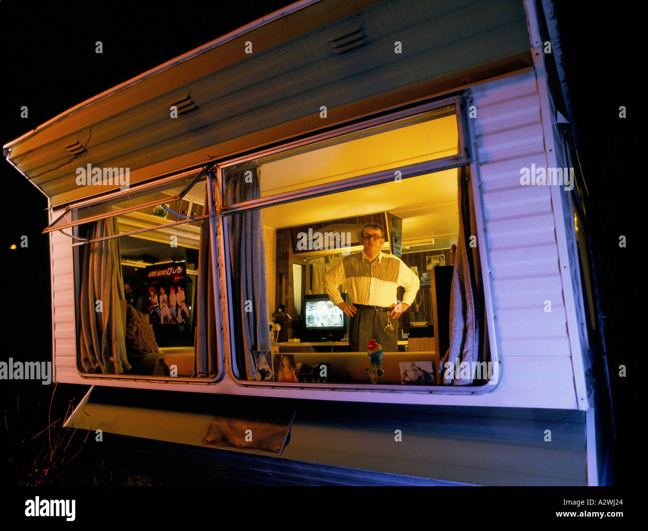 man alone in caravan Stock Photo - Alamy