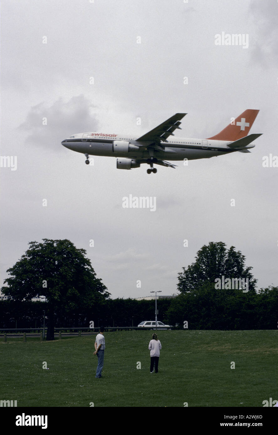 aircraft flying over park near heathrow london england UK Stock Photo ...