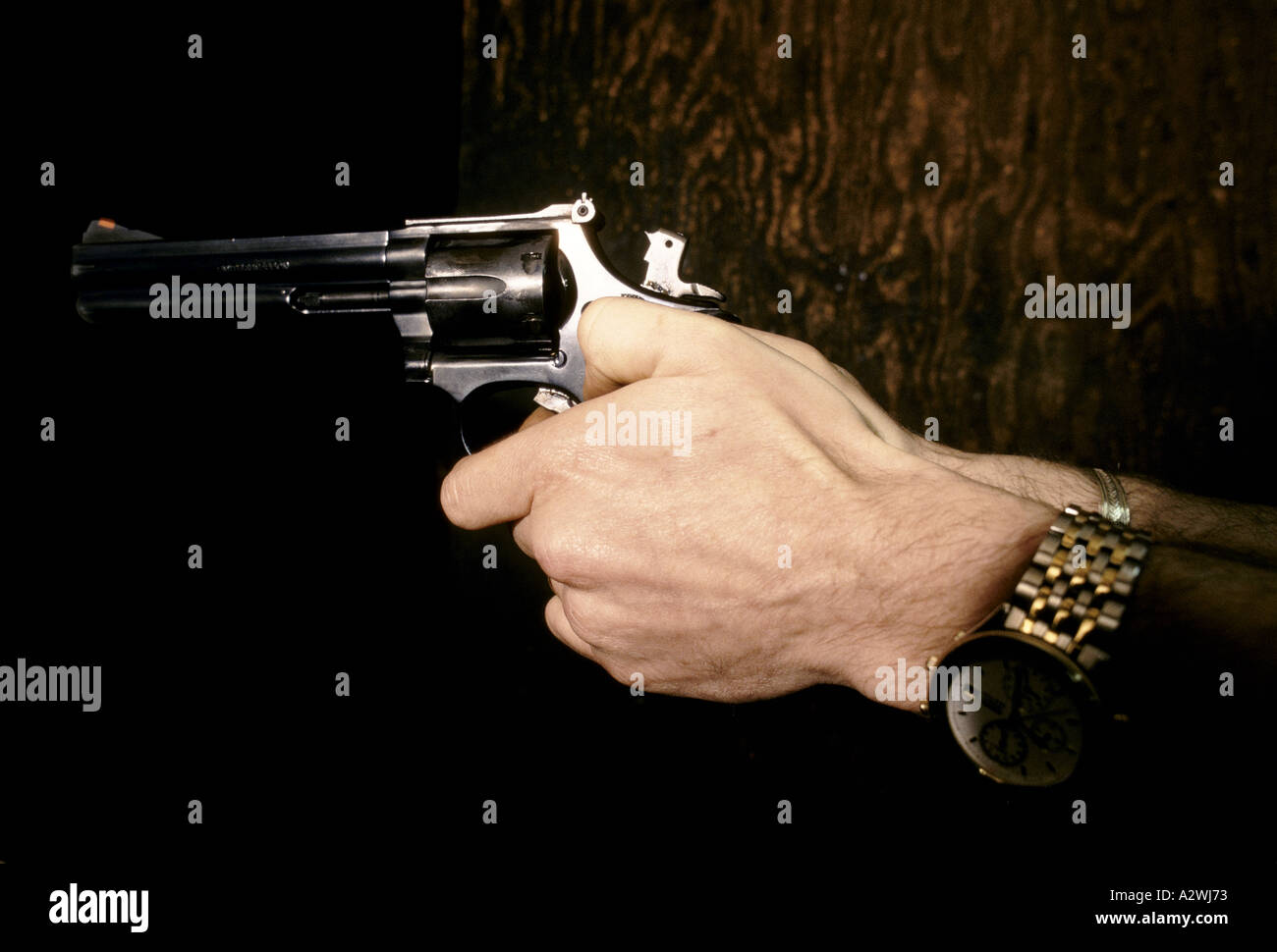 hands hold and point a cocked gun, shooting range, london Stock Photo ...