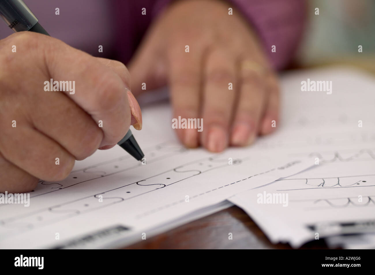 Stroke victim practising her writing Stock Photo - Alamy