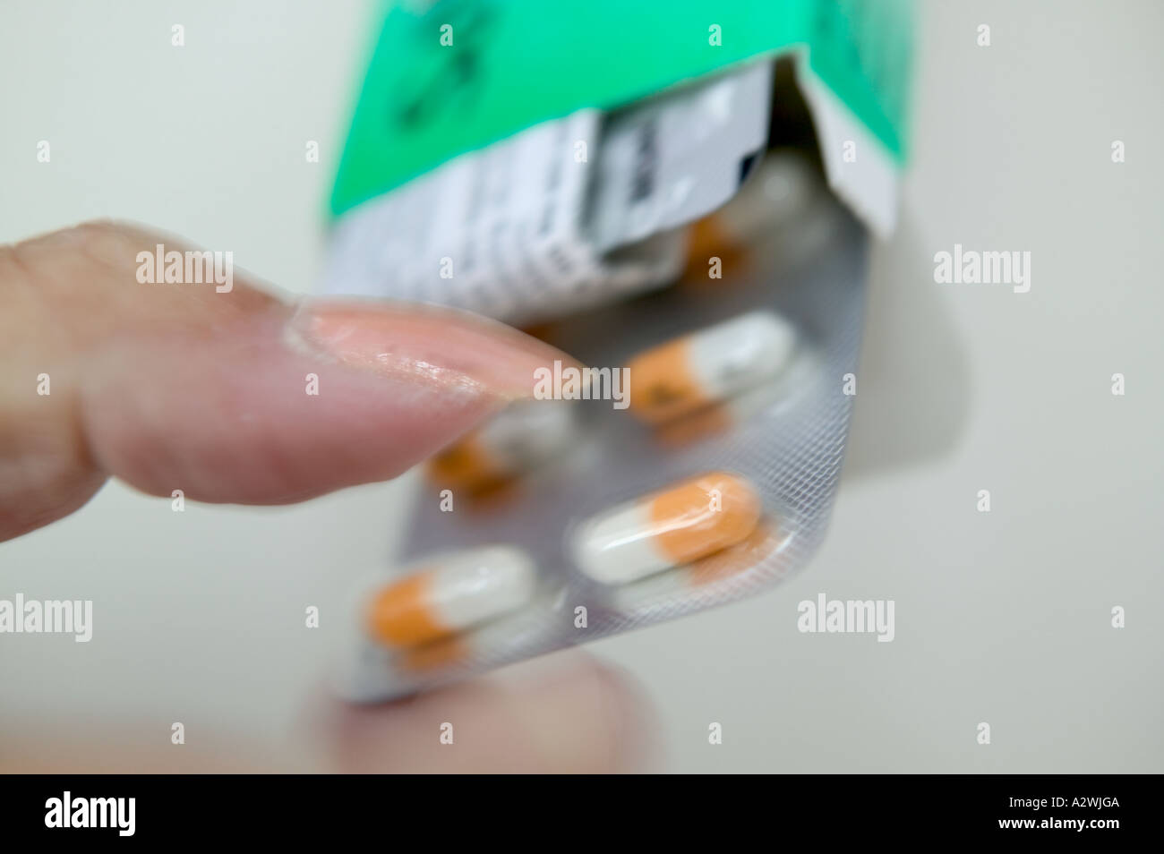 Stroke victim getting tablets out of packet Stock Photo - Alamy