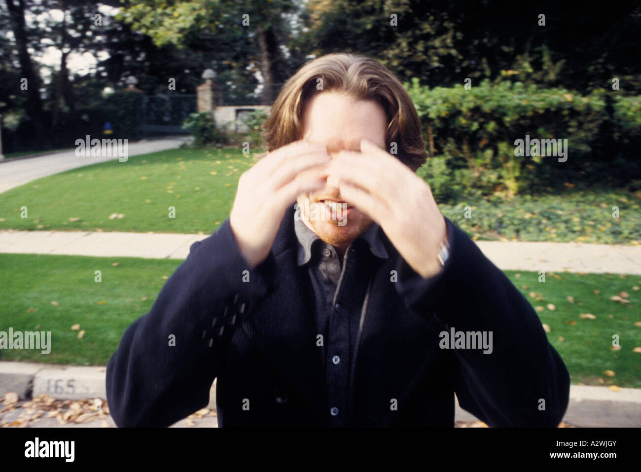 Obscuring face hi-res stock photography and images - Alamy