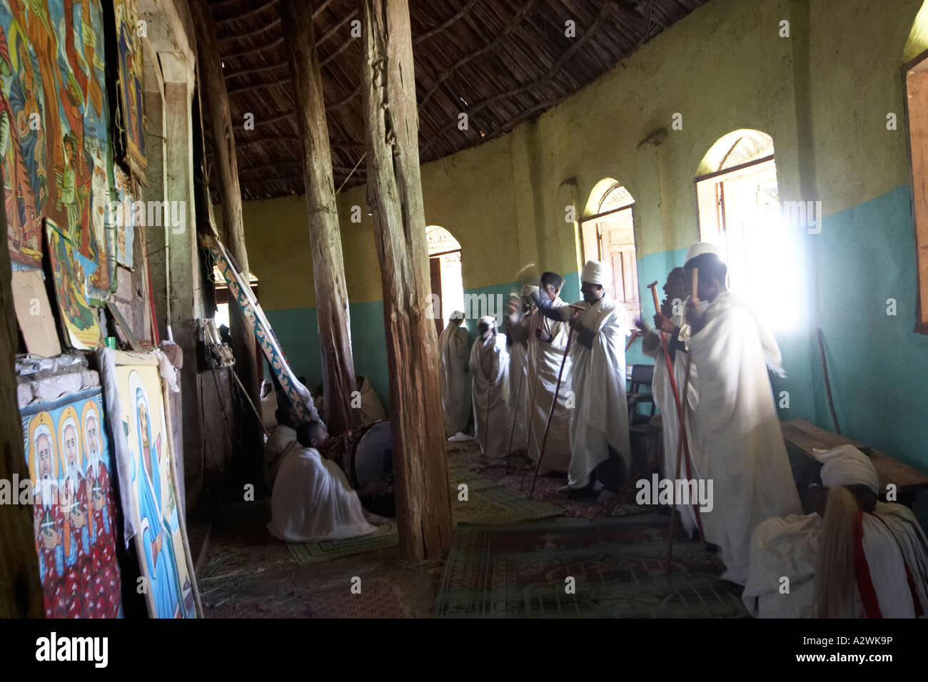 Priests chanting and singing mass with boys playing drums in 14C Debre ...
