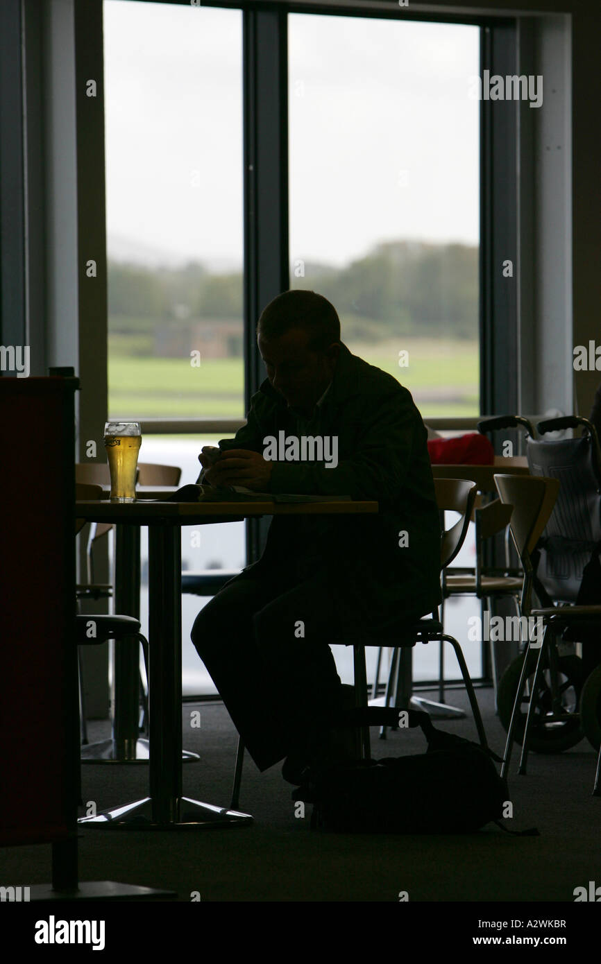 Man sitting at table hi-res stock photography and images - Alamy