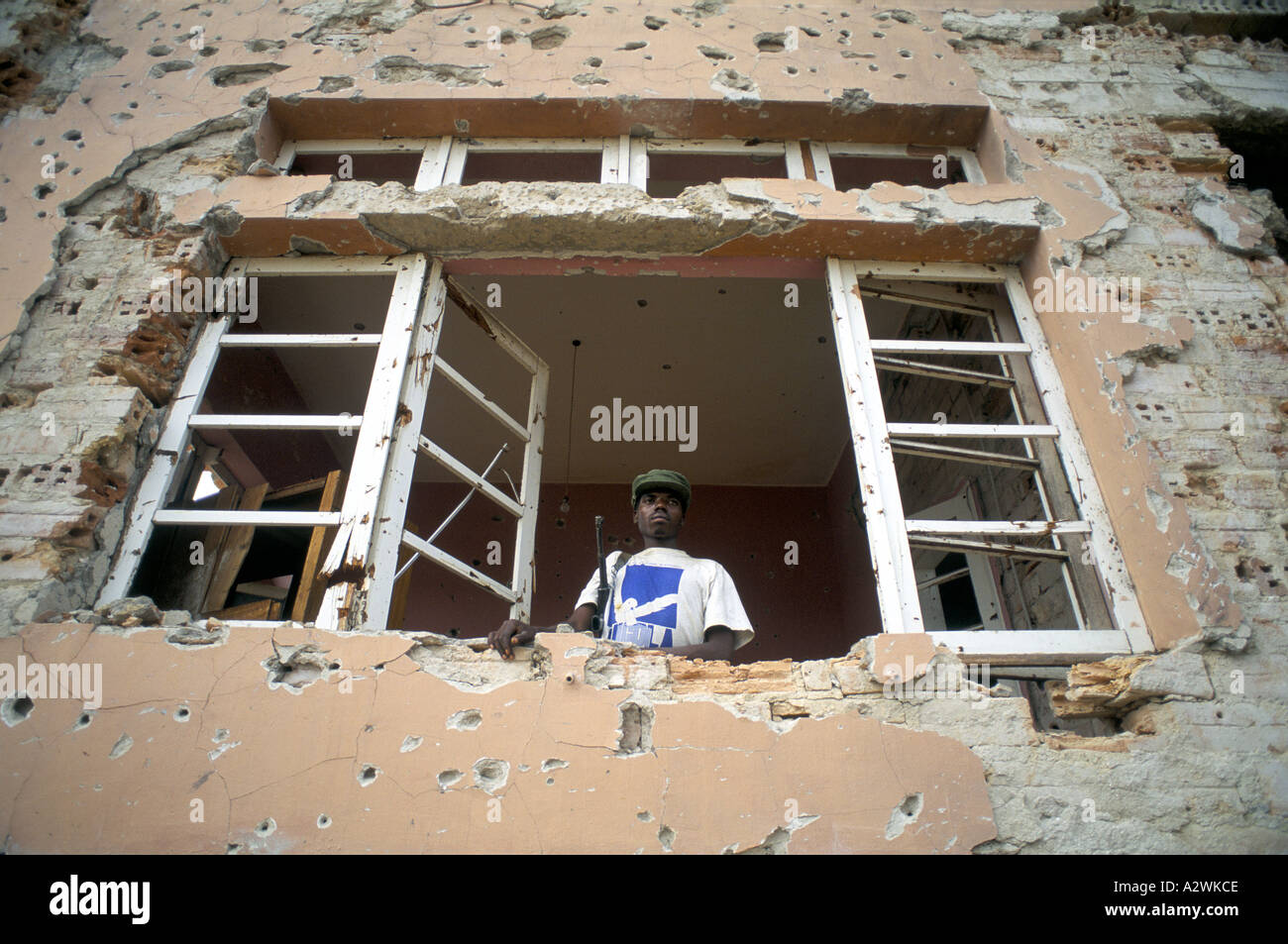 angola oct 1993 mpla soldier looks out of a window in cuito Stock Photo ...