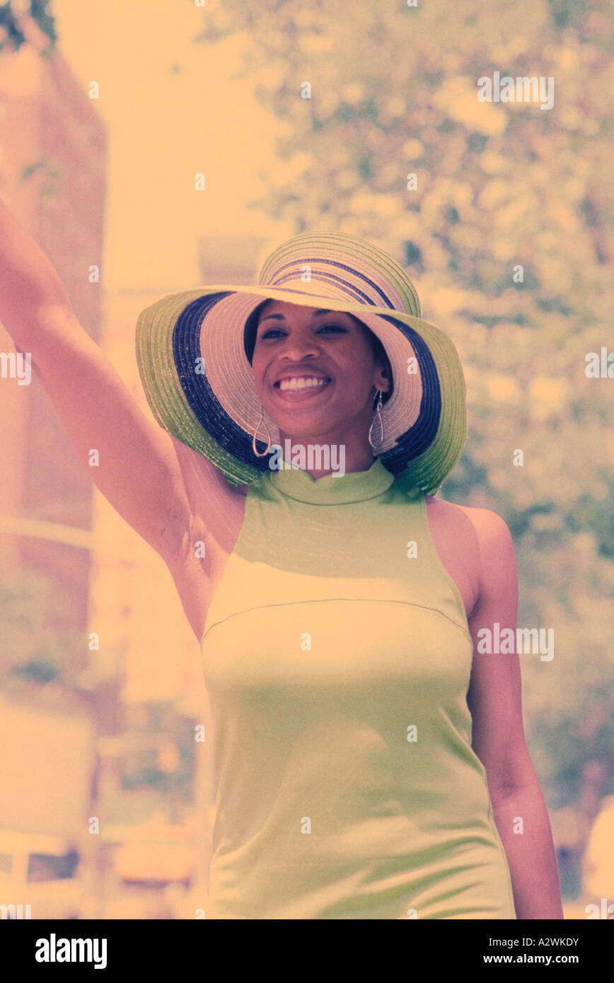 Young woman waving hand, smiling Stock Photo - Alamy