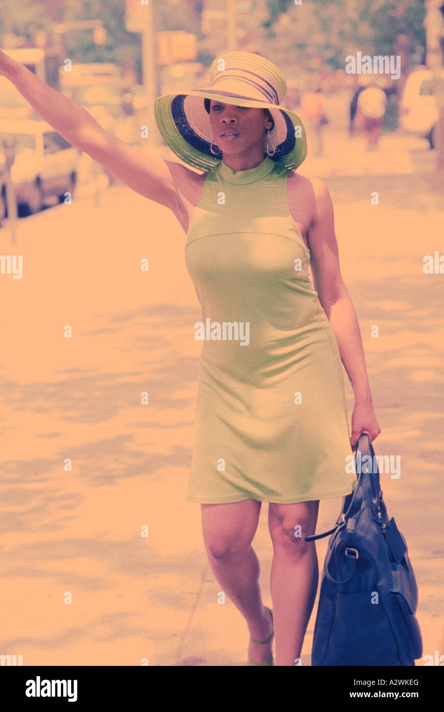 Young woman waving hand Stock Photo - Alamy