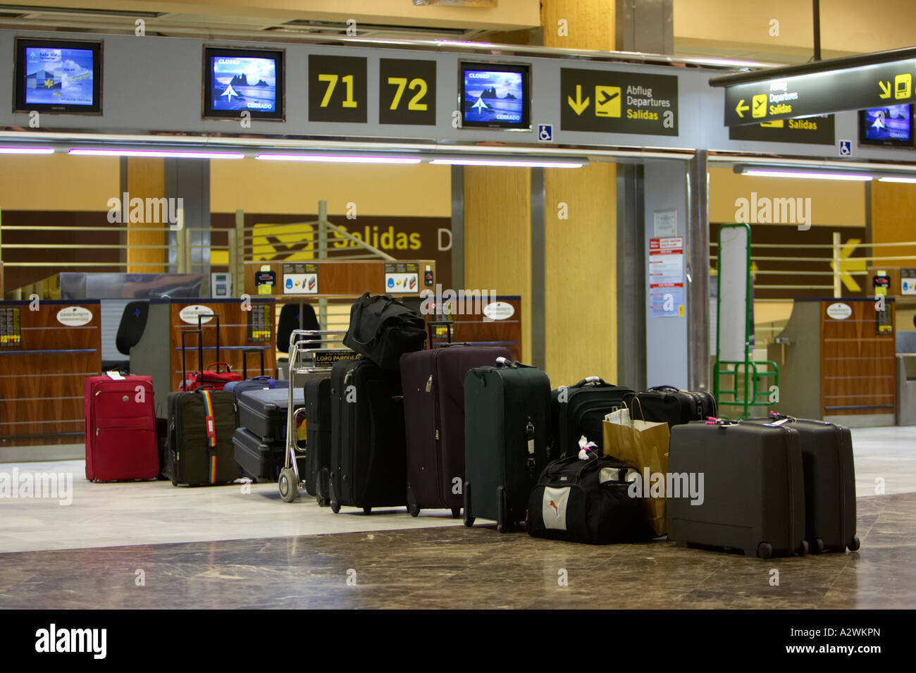 Queue of luggage at check in desks at Reina Sofia Sur TFS South Airport ...