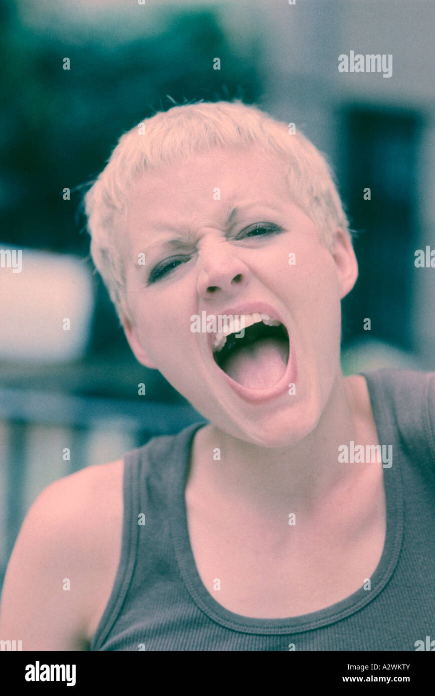 Young woman shouting, portrait Stock Photo - Alamy