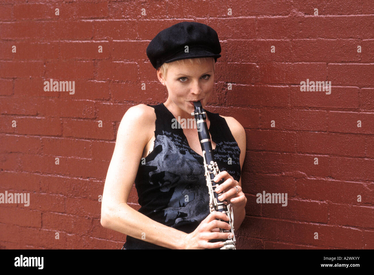 Woman playing flutes hi-res stock photography and images - Alamy