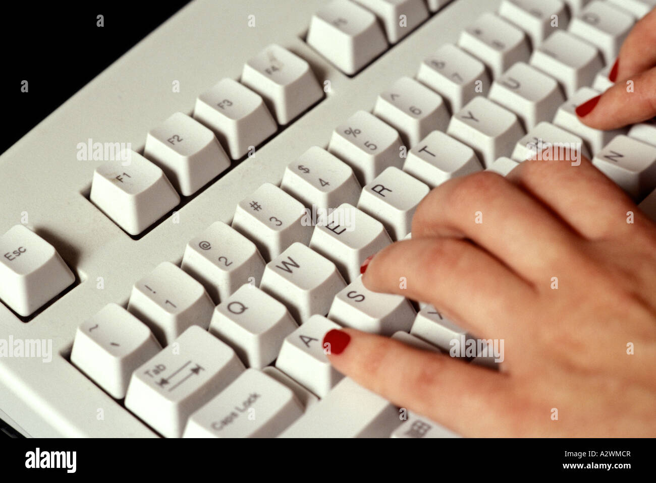 Woman's hand on computer keyboard, close up Stock Photo - Alamy