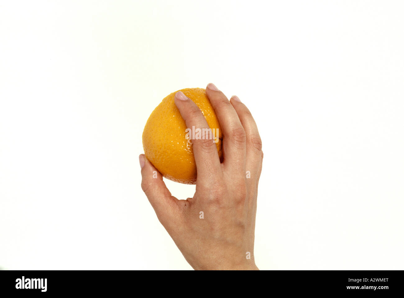 Human hand holding orange, close up Stock Photo - Alamy