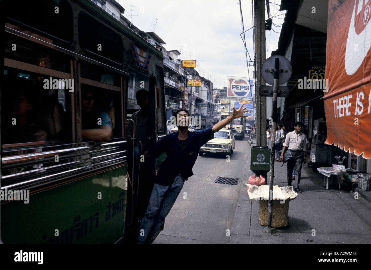 Bus conductor on bus in Bangkok, Thailand Stock Photo - Alamy