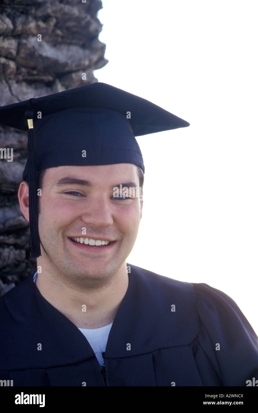 Young man in graduation outfit, smiling, portrait Stock Photo - Alamy