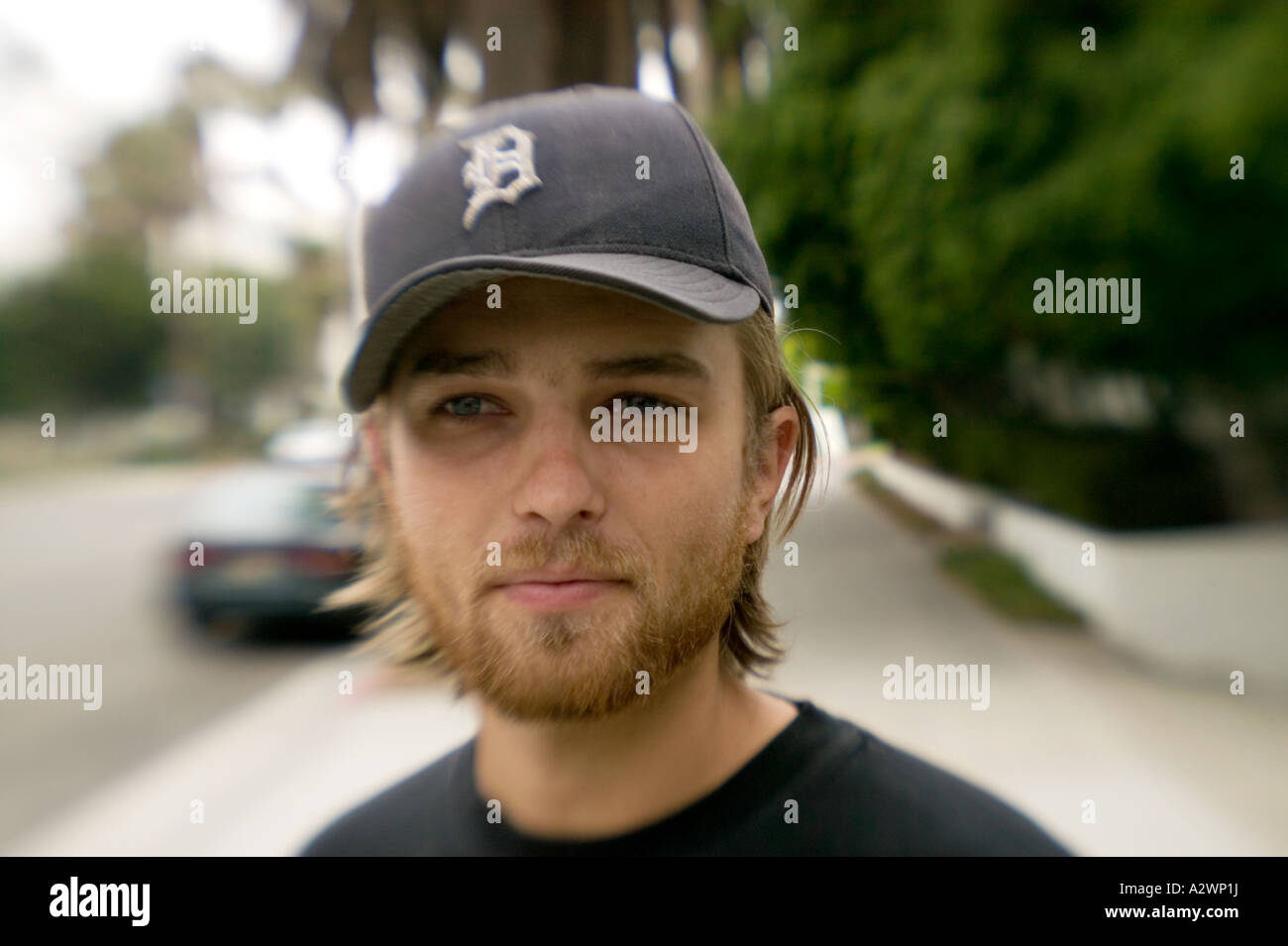Young man wearing cap, portrait Stock Photo - Alamy