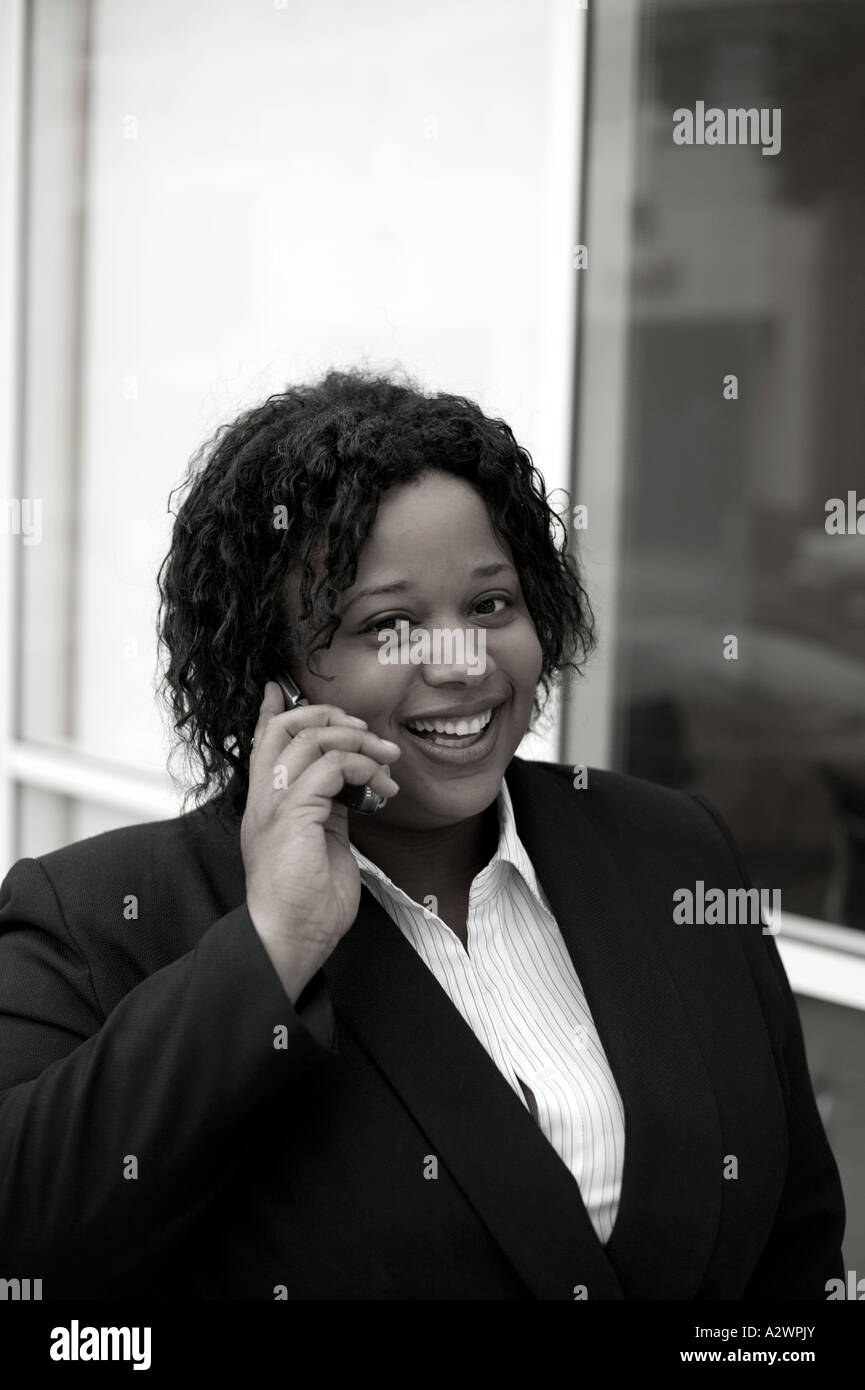 Businesswoman using mobile phone, portrait (B&W Stock Photo - Alamy