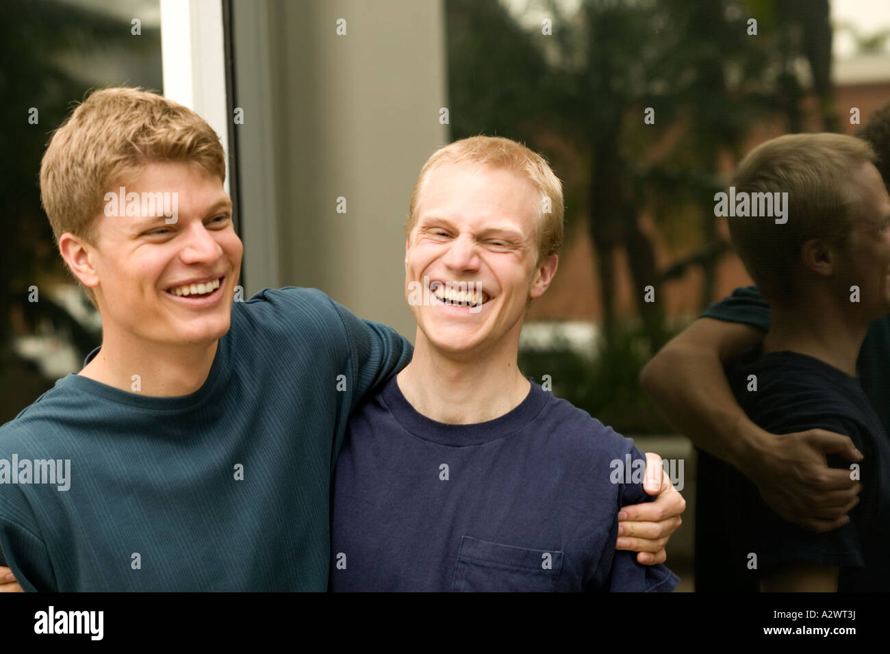 Young men smiling, portrait Stock Photo - Alamy