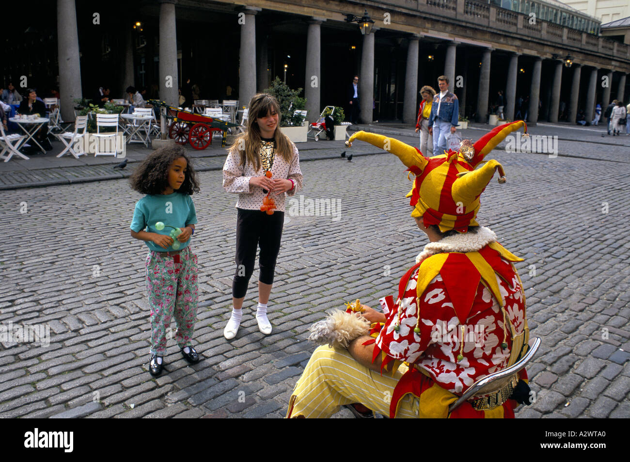 street performer audience jester performing in covent garden piazza to ...