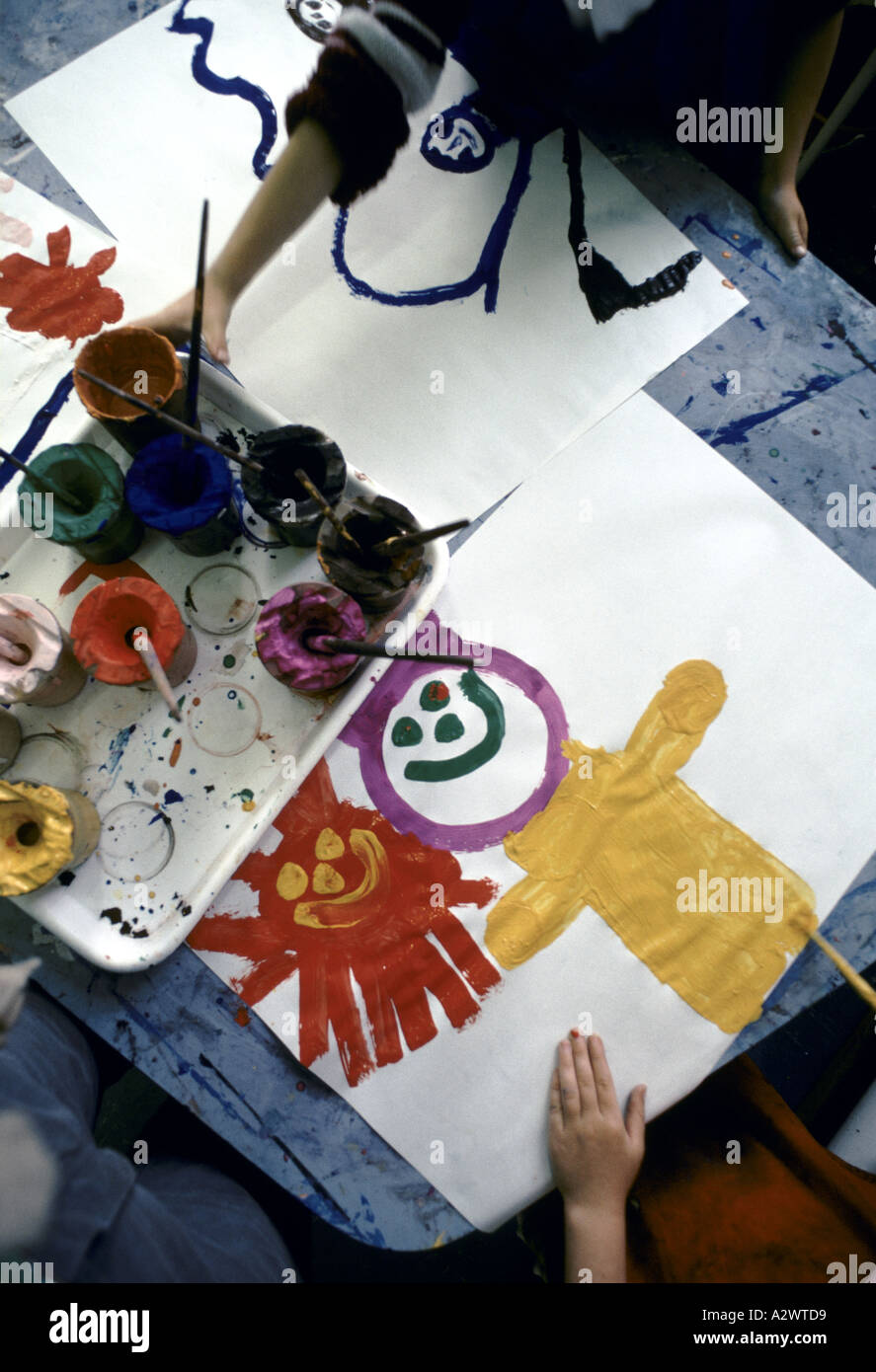 children painting primary school art lesson Stock Photo - Alamy