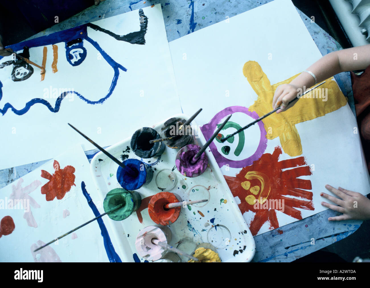 children painting primary school art lesson Stock Photo - Alamy