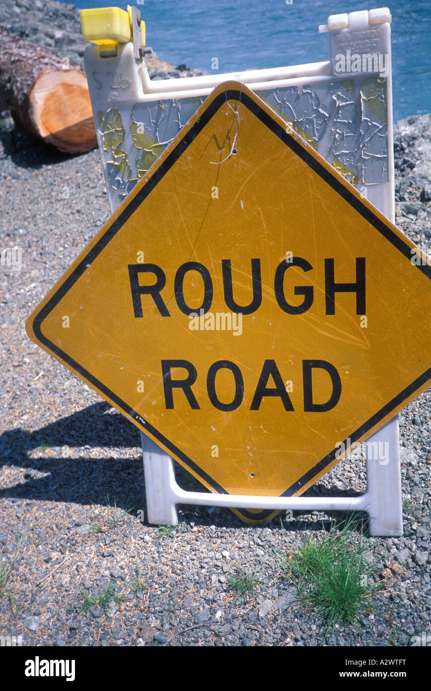View of hoarding with rough road sign Stock Photo - Alamy