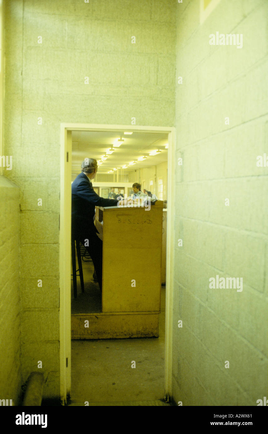 A prison officer at his desk. Brixton Prison, London, UK Stock Photo ...