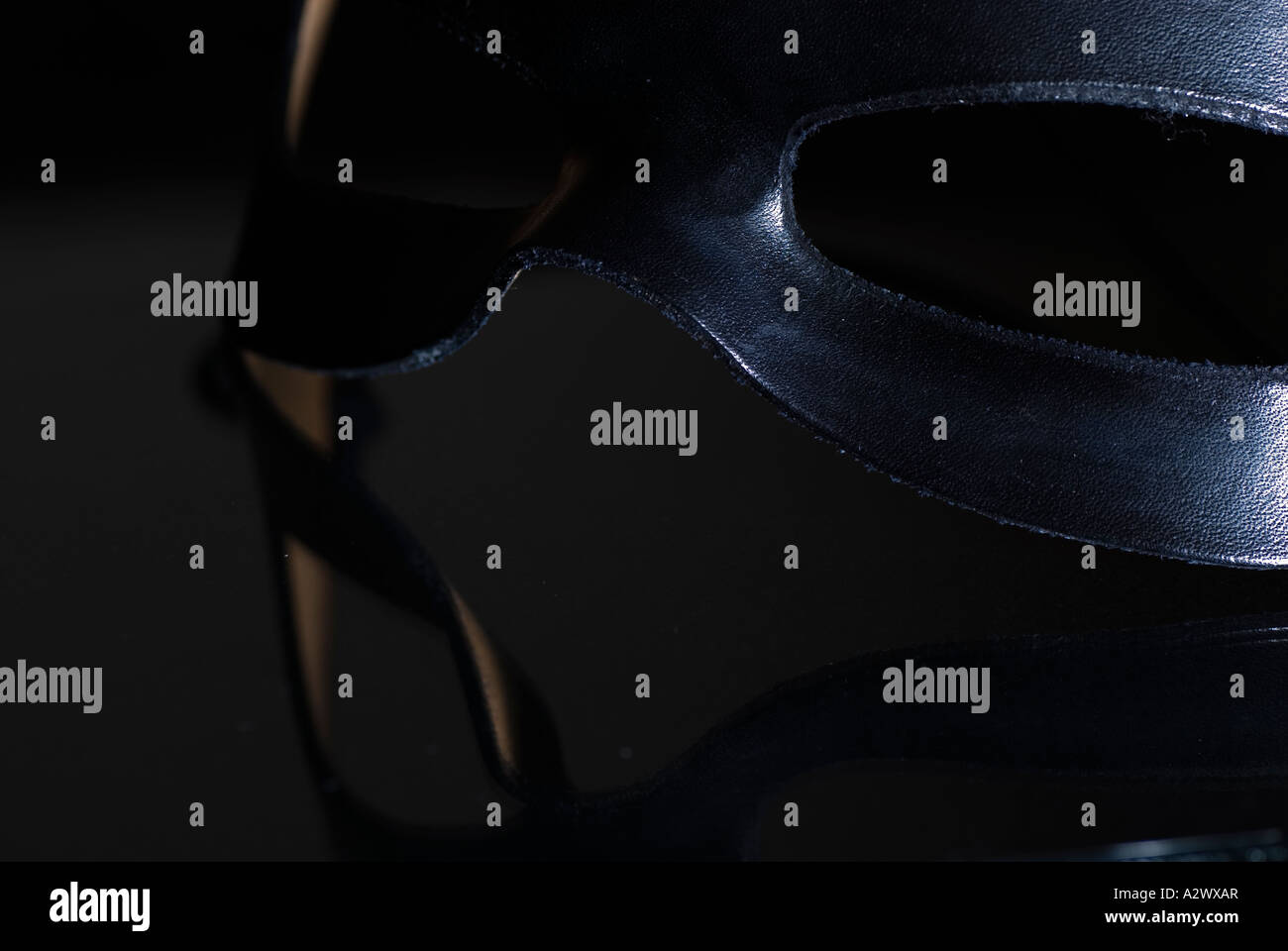 Black leather half-mask and reflection Stock Photo - Alamy