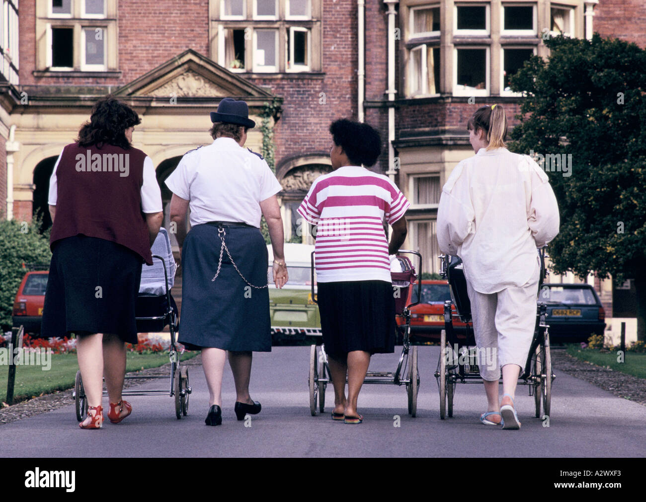 Here a prison officer accompanies three mothers and their babies in ...