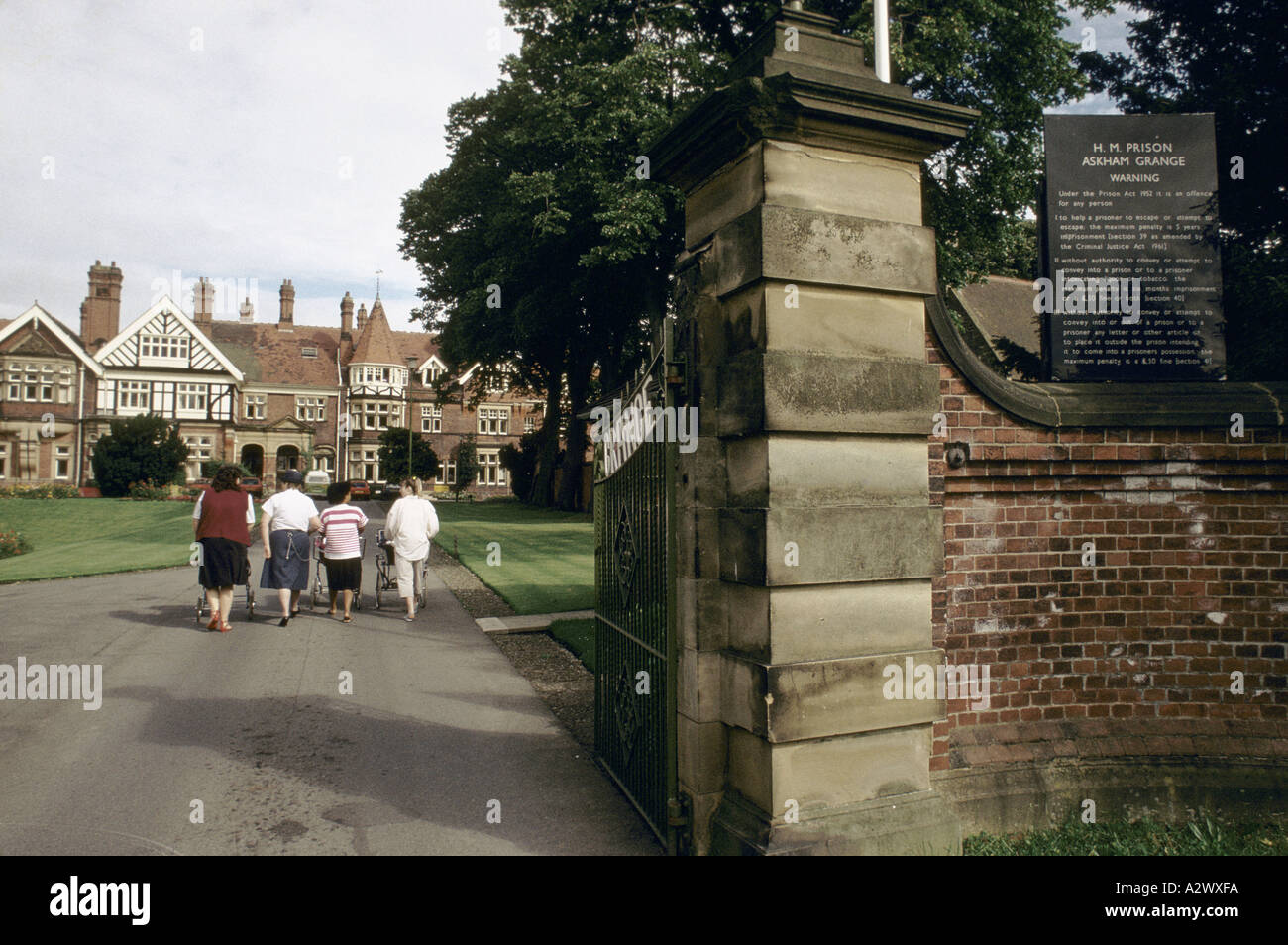 Here a prison officer accompanies three mothers and their babies in ...