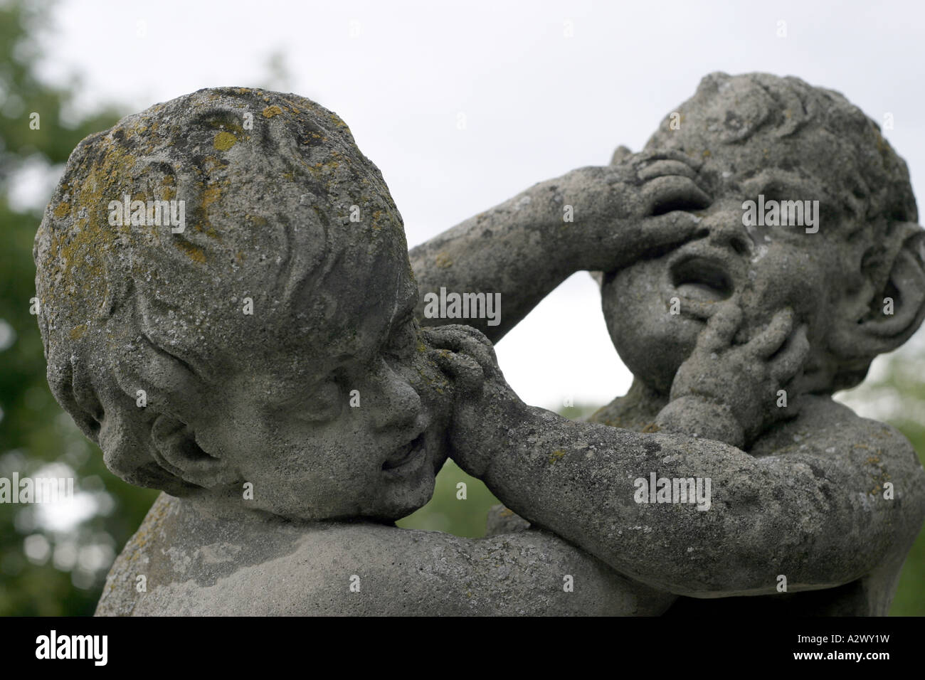 Stone boys fighting Stock Photo - Alamy