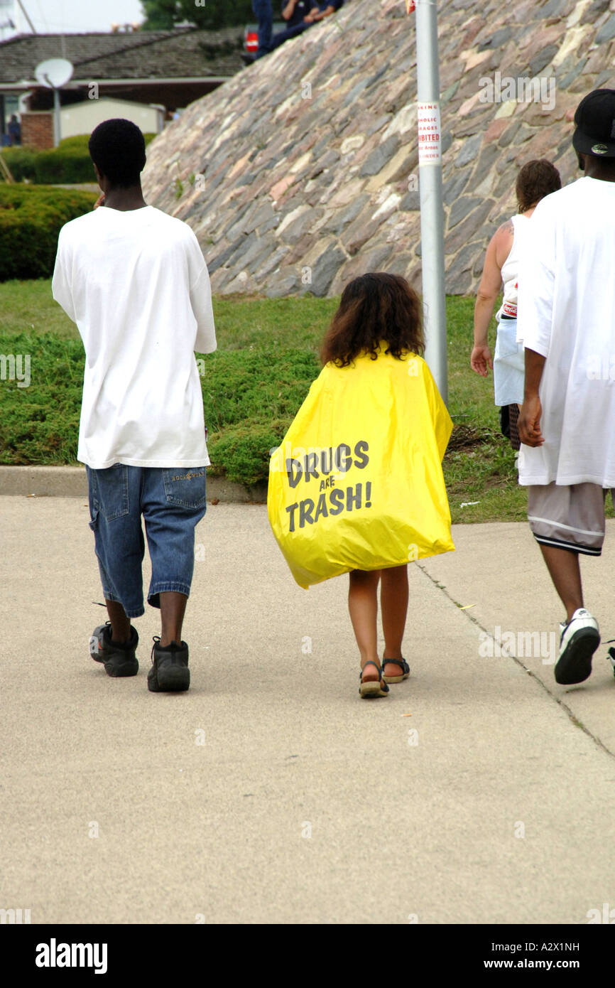 Young female carrying a bag saying Drugs are Trash Stock Photo - Alamy