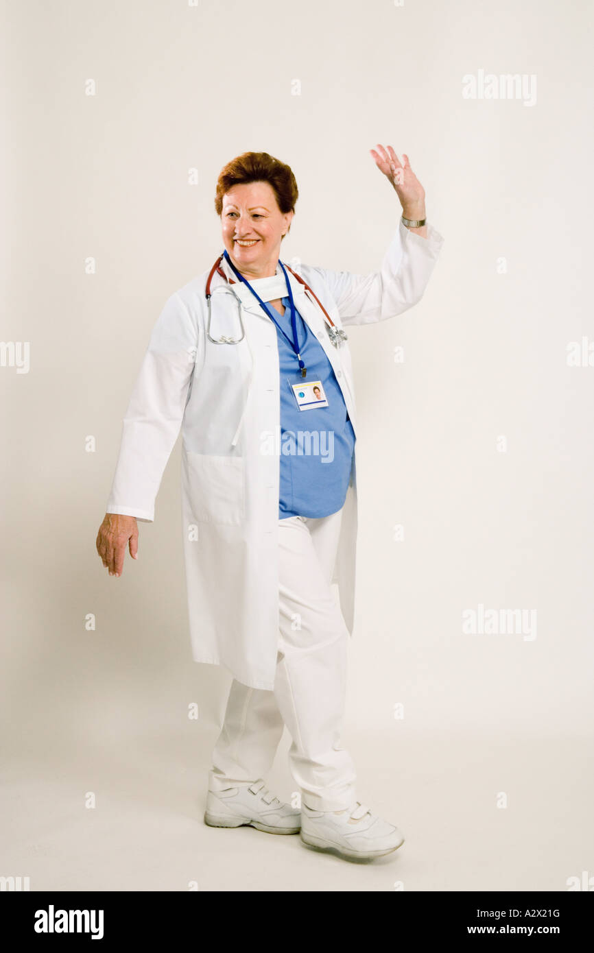 Female physician portrait walking in the hallway. Professional pose ...