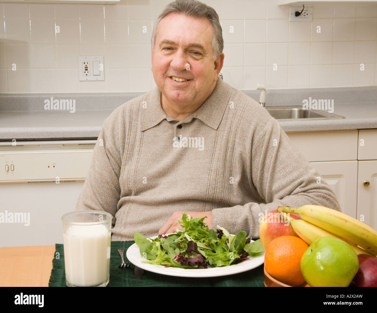 Man eating healthy salad Stock Photo - Alamy