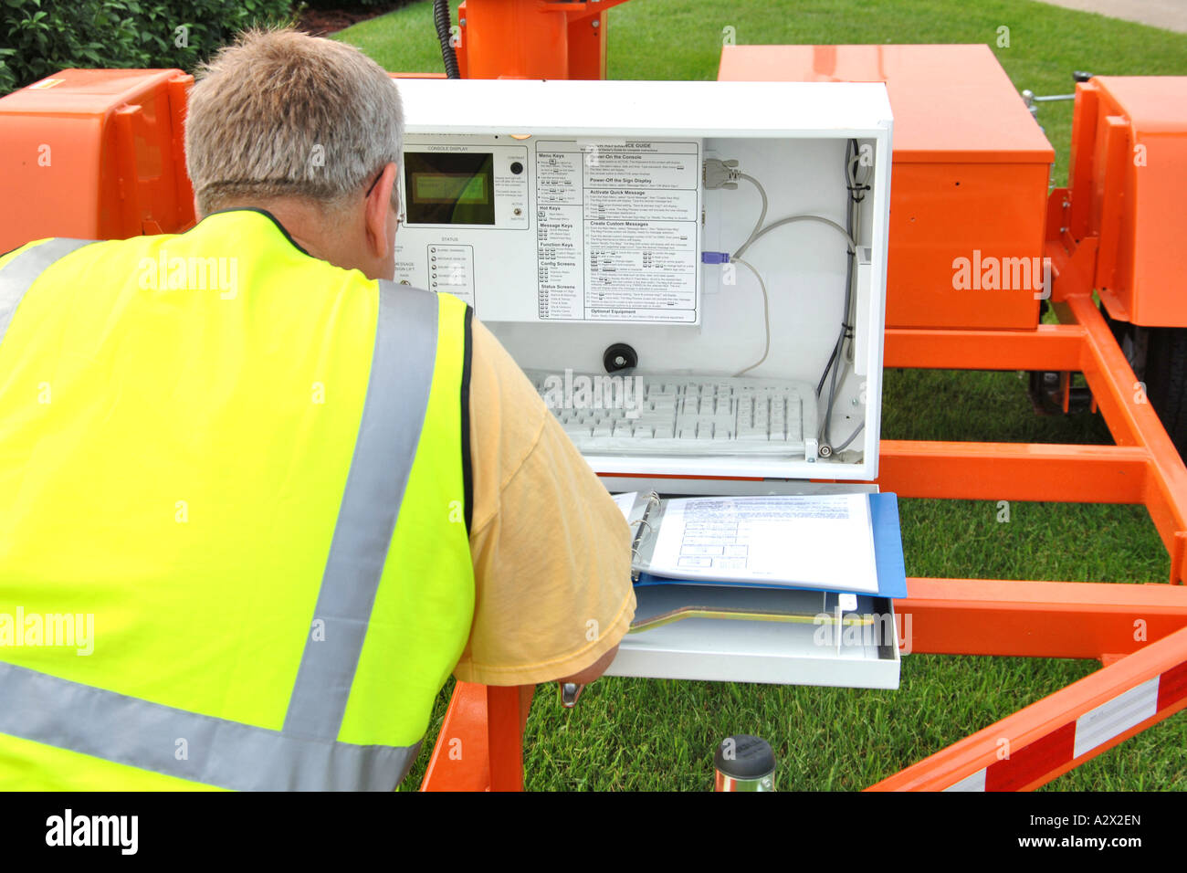 An Optical Traffic sign programmer at work typing in road maintenance ...