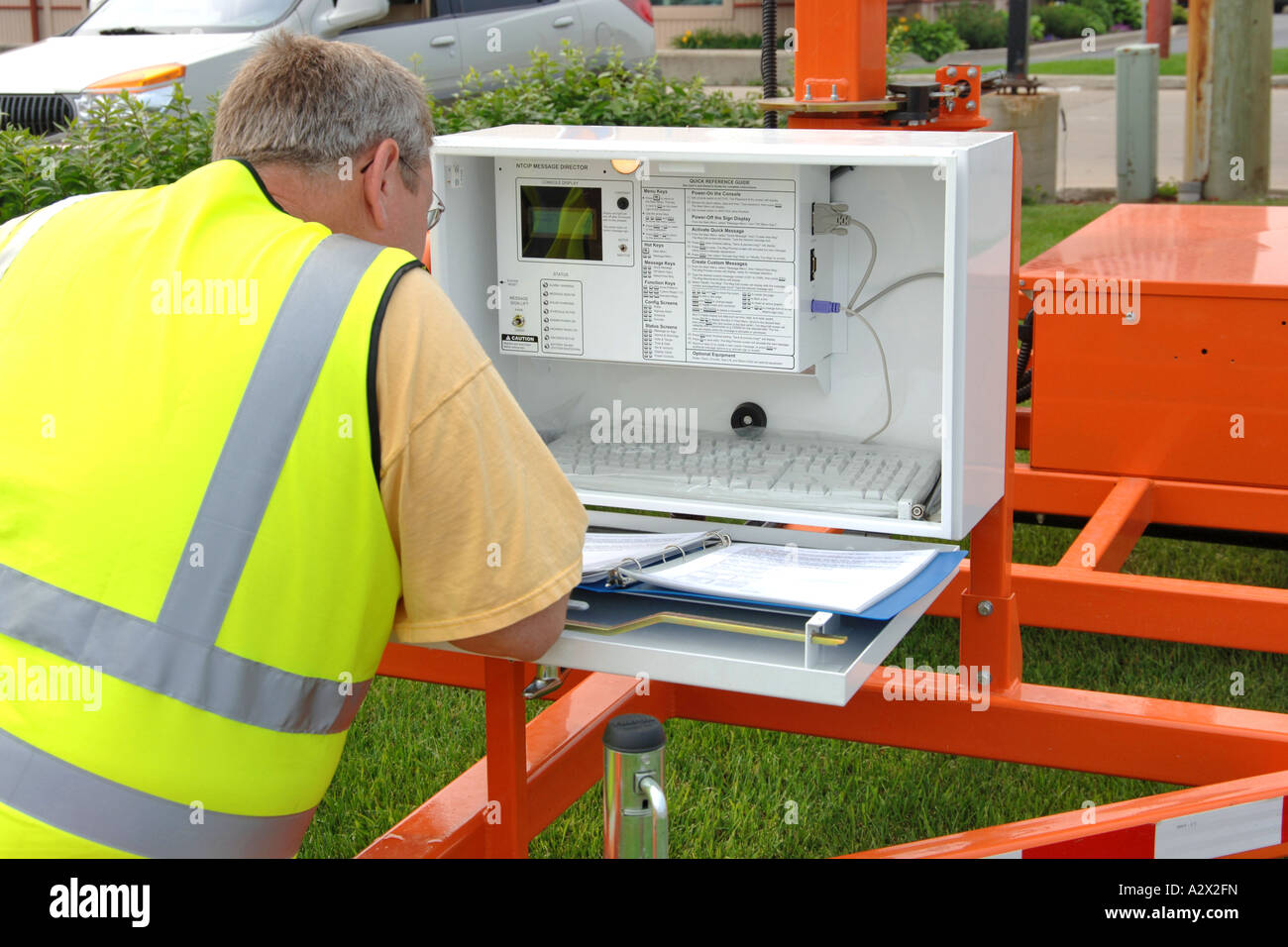 An Optical Traffic sign programmer at work typing in road maintenance ...