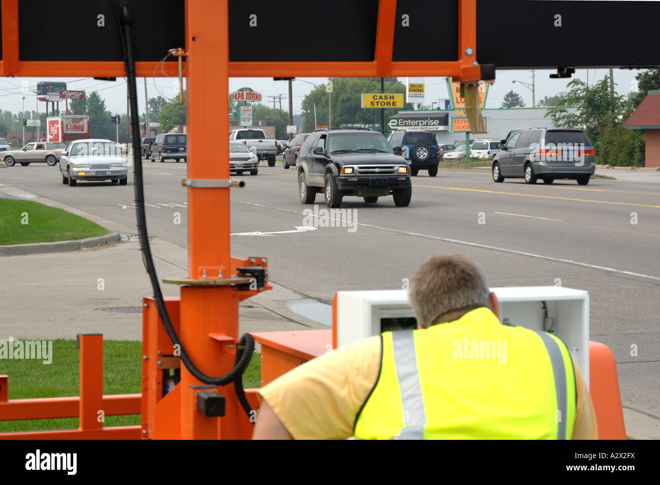 An Optical Traffic sign programmer at work typing in road maintenance ...