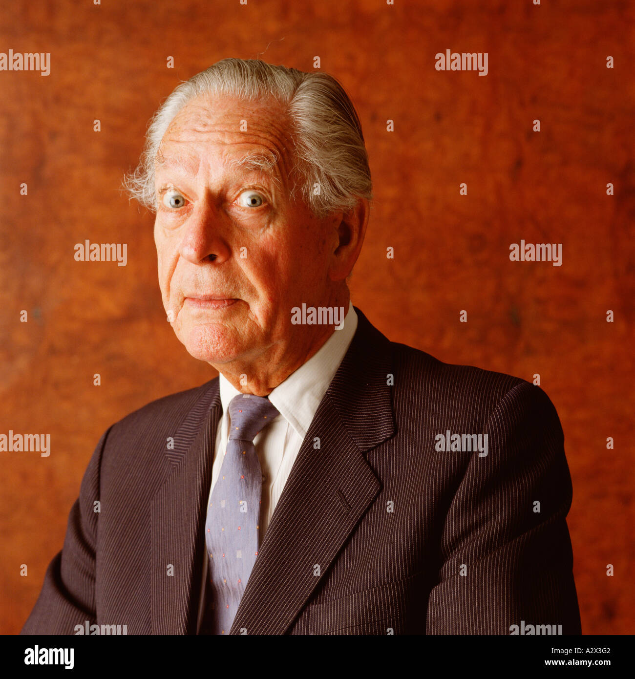 Studio portrait of old man in business suit Stock Photo - Alamy
