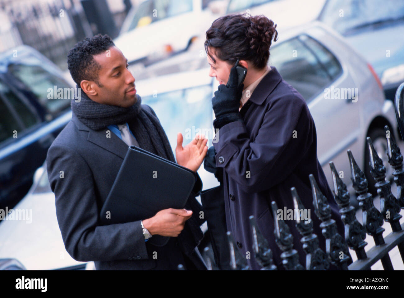 Man and woman in city street. Work colleagues Stock Photo - Alamy