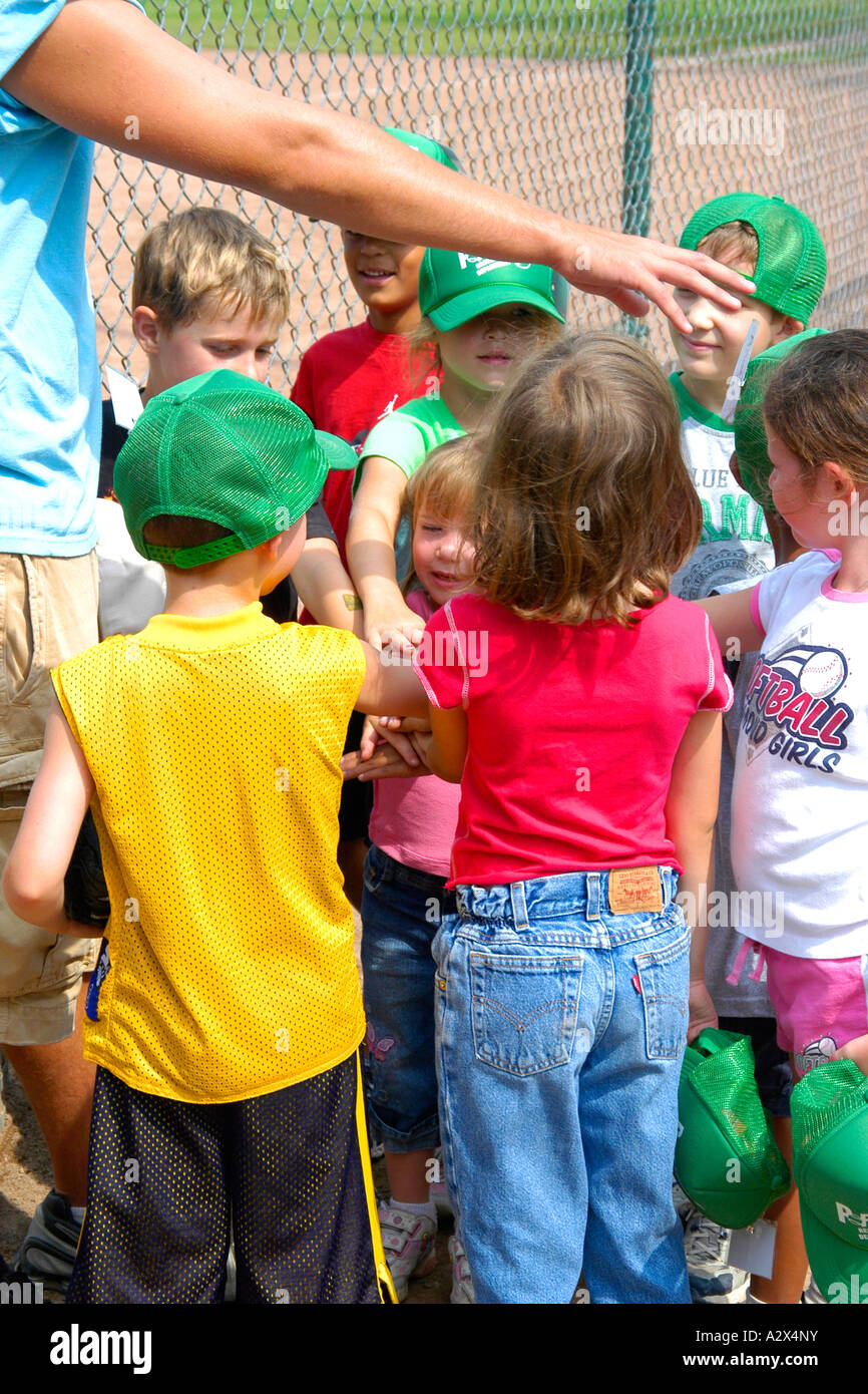 Pre-K Children taking part in a T Ball game at a summer childrens ...