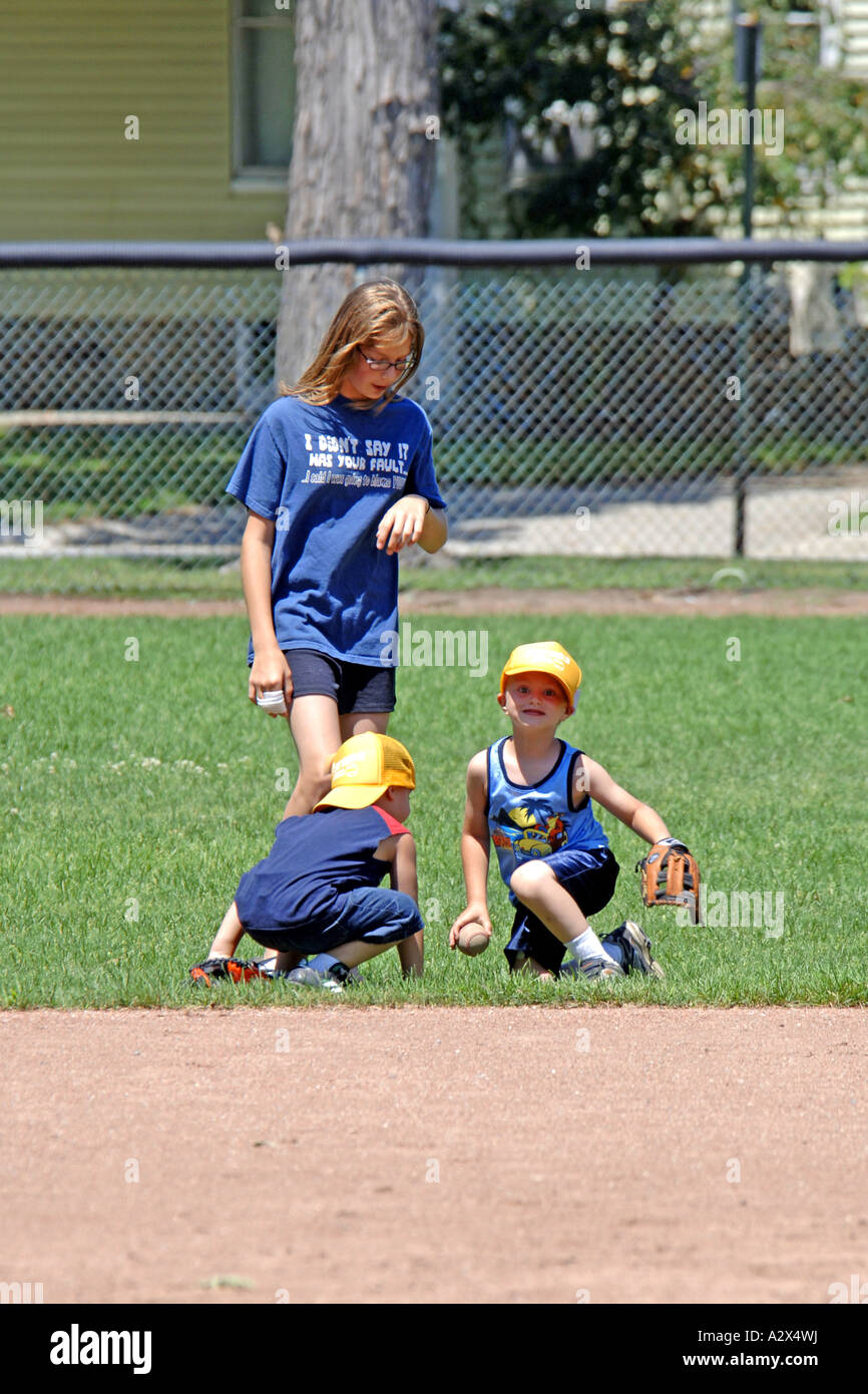 Pre-K Children taking part in a T Ball game at a summer childrens ...