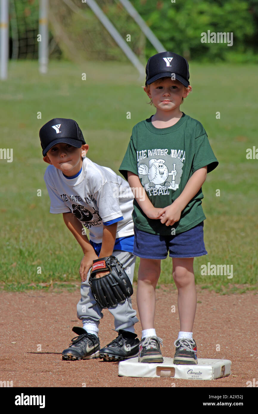 Young boy and girl taking part in a Pre-K T-Ball practice game Stock ...