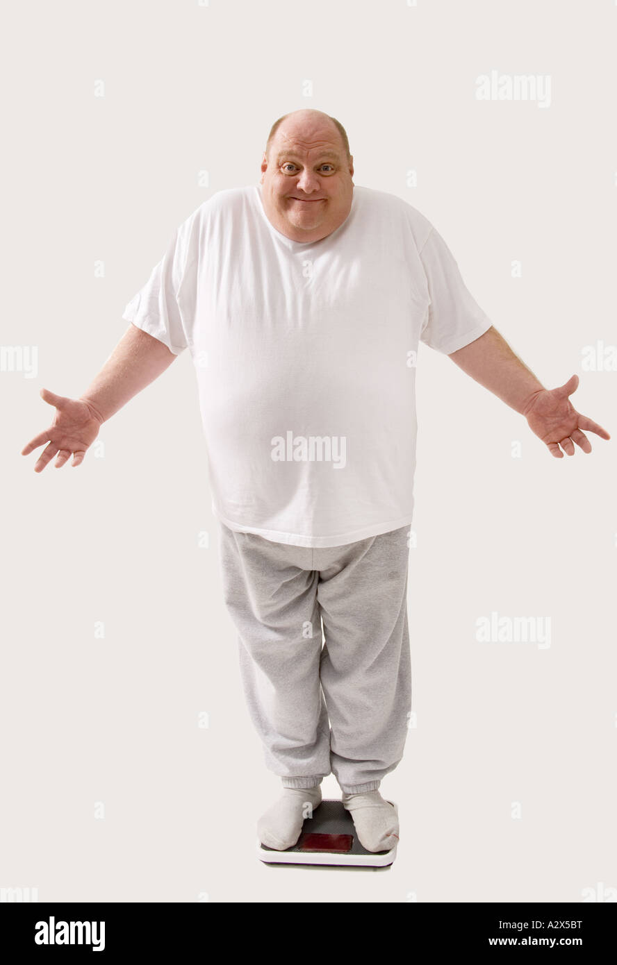Full body view of overweight man standing on a scale Stock Photo - Alamy