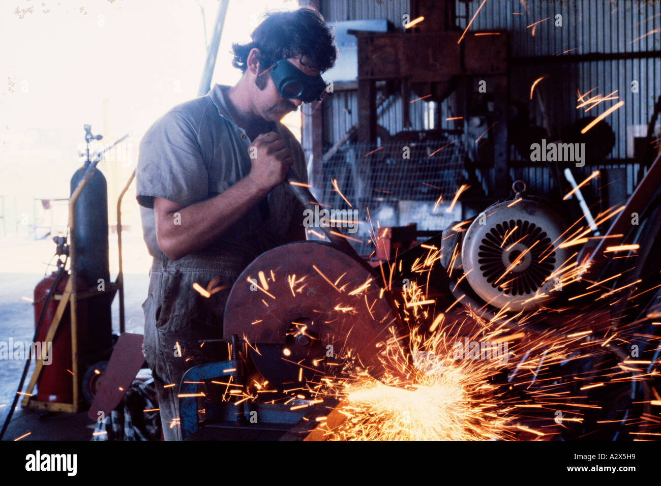 Industrial worker grinding machine on hi-res stock photography and ...