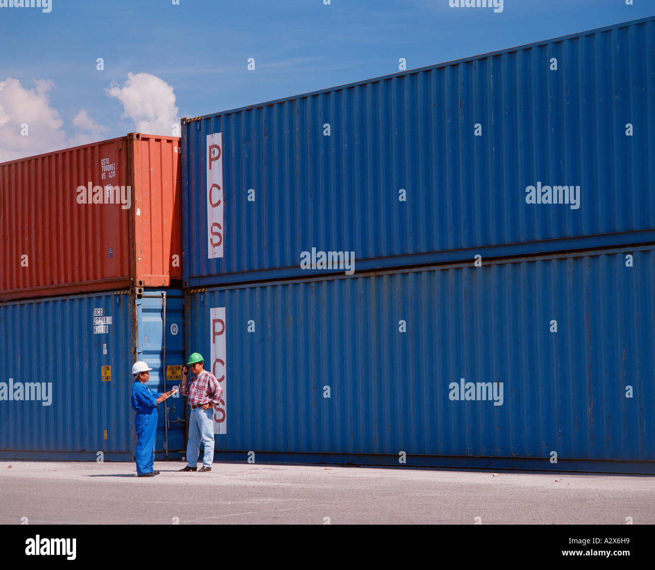 Philippines. Manila. International Container Terminal. Two men workers ...
