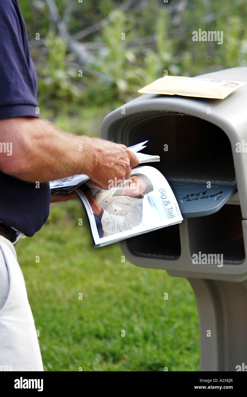 Collecting the usual junk mail from your postbox, this man checks ...